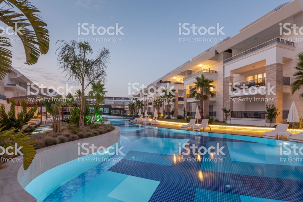 Luxury Construction hotel with Swimming Pool at sunset | Core Hotels ...
